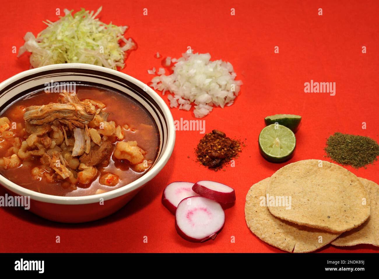 Typical Mexican food, plate of pozole with corn, meat, vegetables and ...