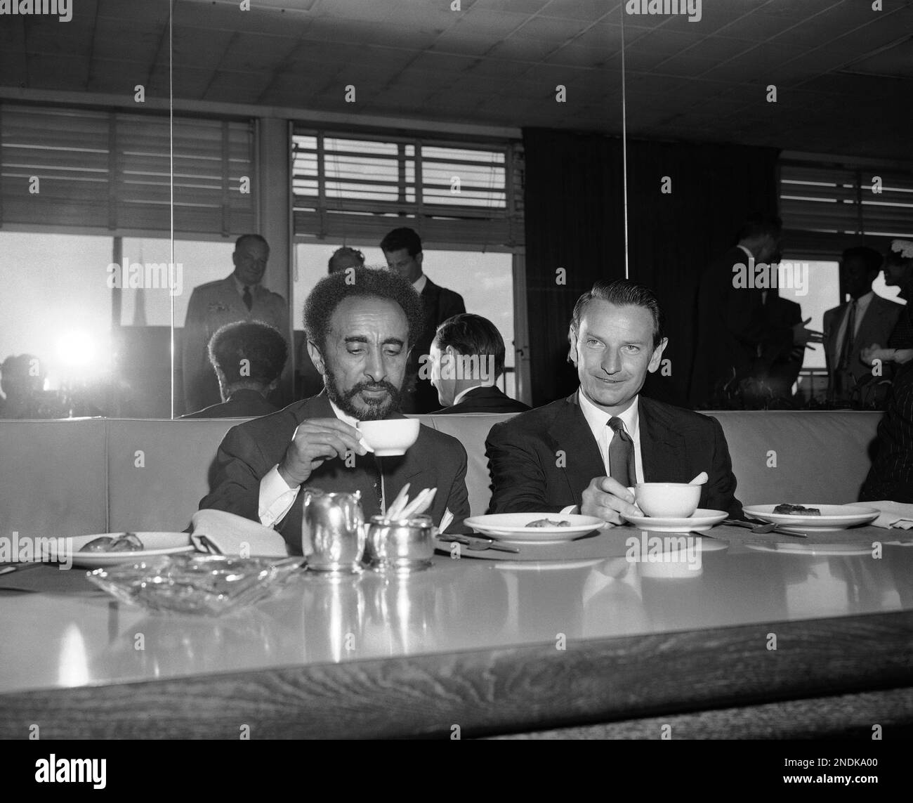 Emperor Haile Selassie of Ethiopia, left, drinks coffee with Laurence ...