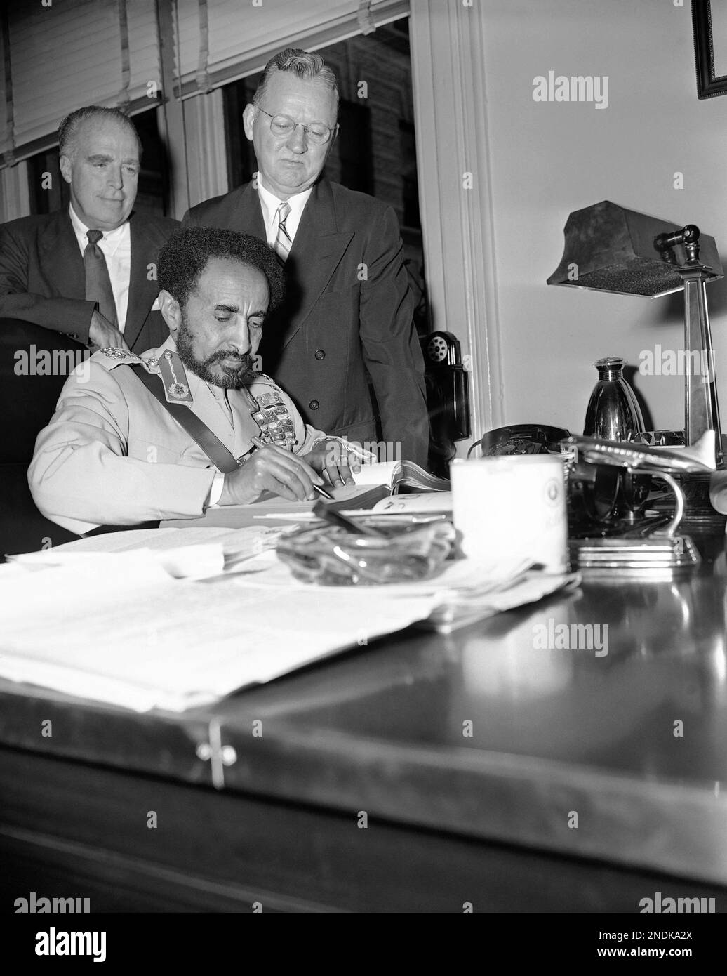 Emperor Haile Selassie of Ethiopia signs guest book at Boston City Hall ...