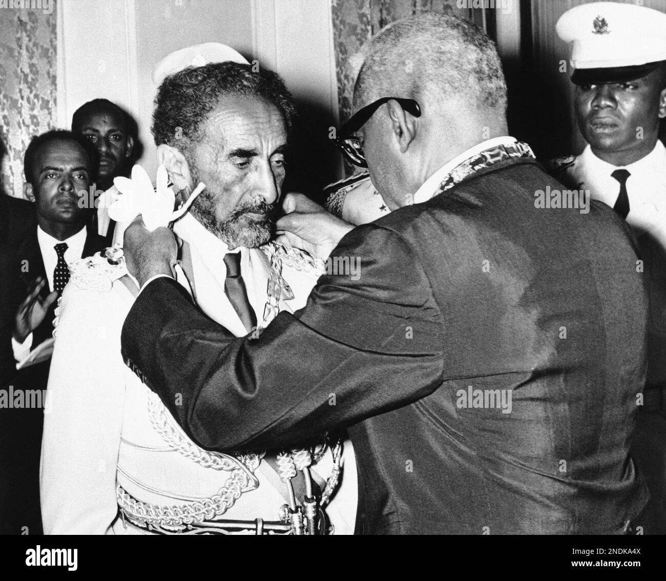 President Francois Duvalier, right, places a decoration around the neck ...