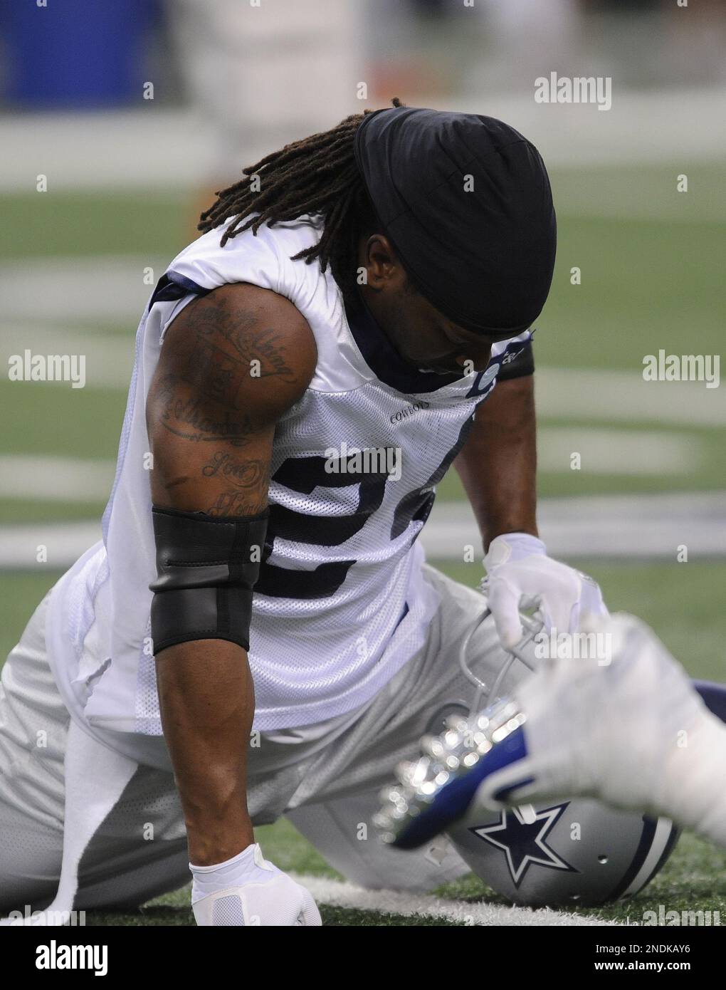 Dallas Cowboys running back Marion Barber (24) stretches with the team ...