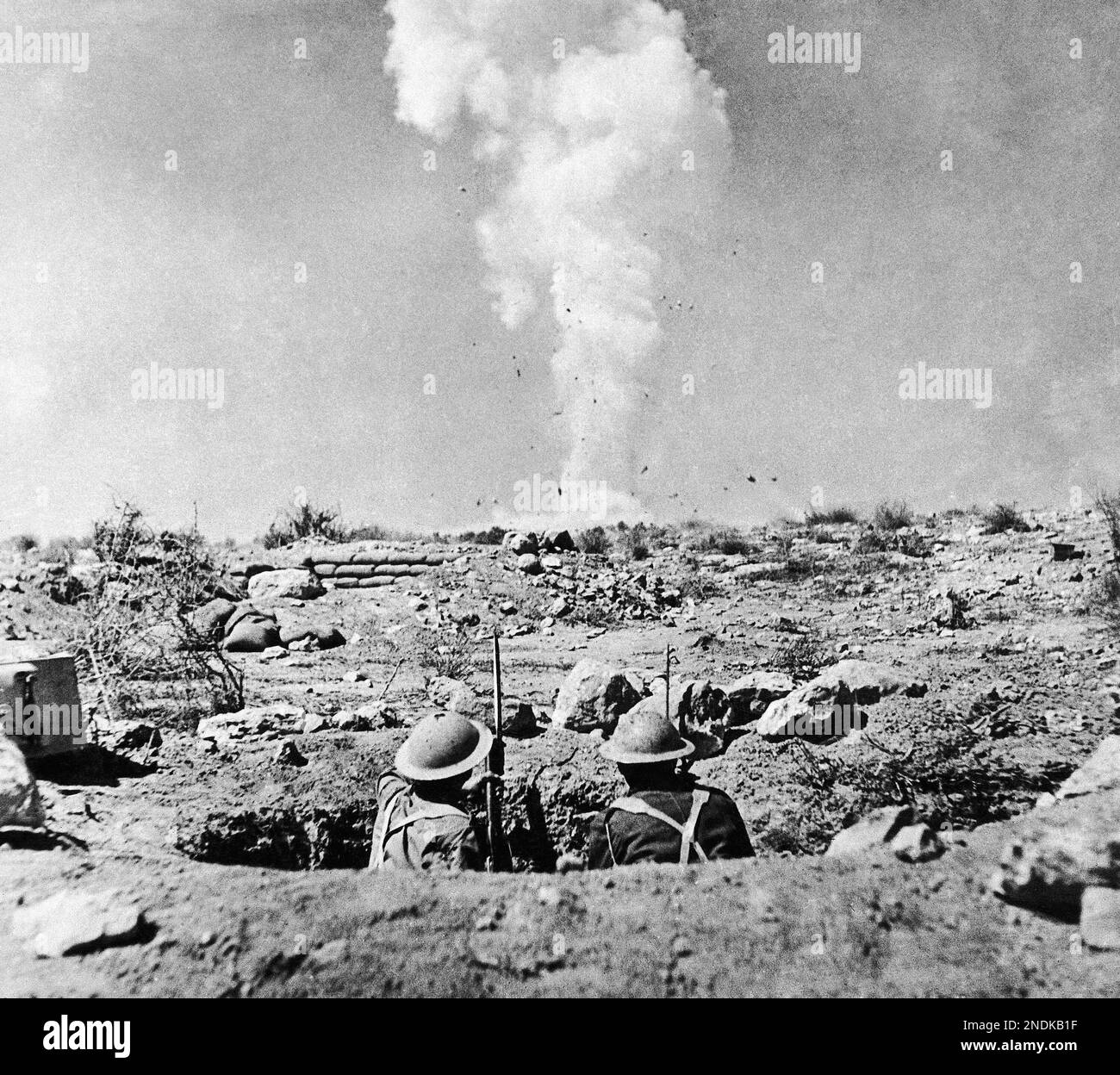 A South African patrol shelters as enemy mortar fire comes unpleasantly ...