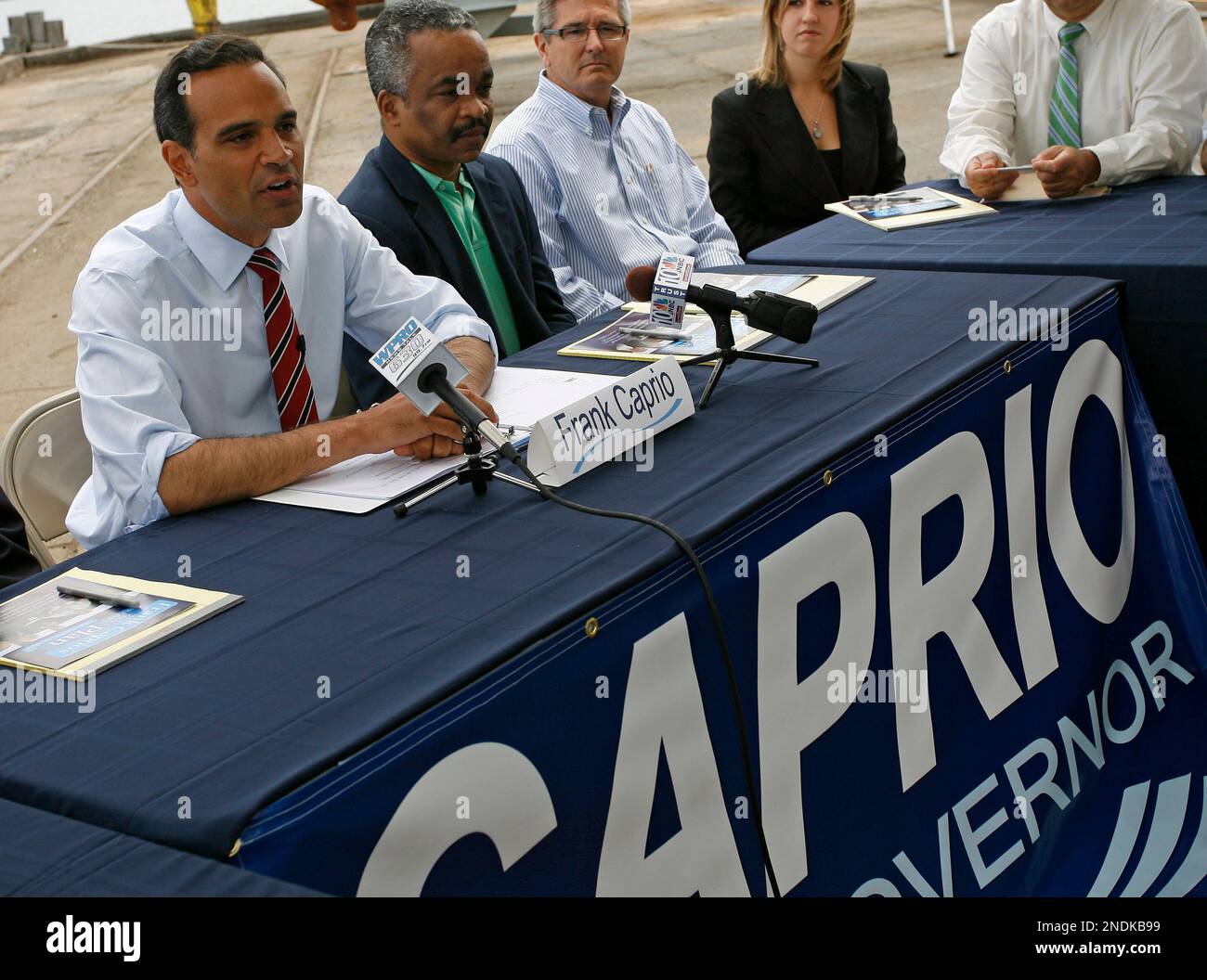 Surrounded by small business owners Frank Caprio, left, Rhode Island ...