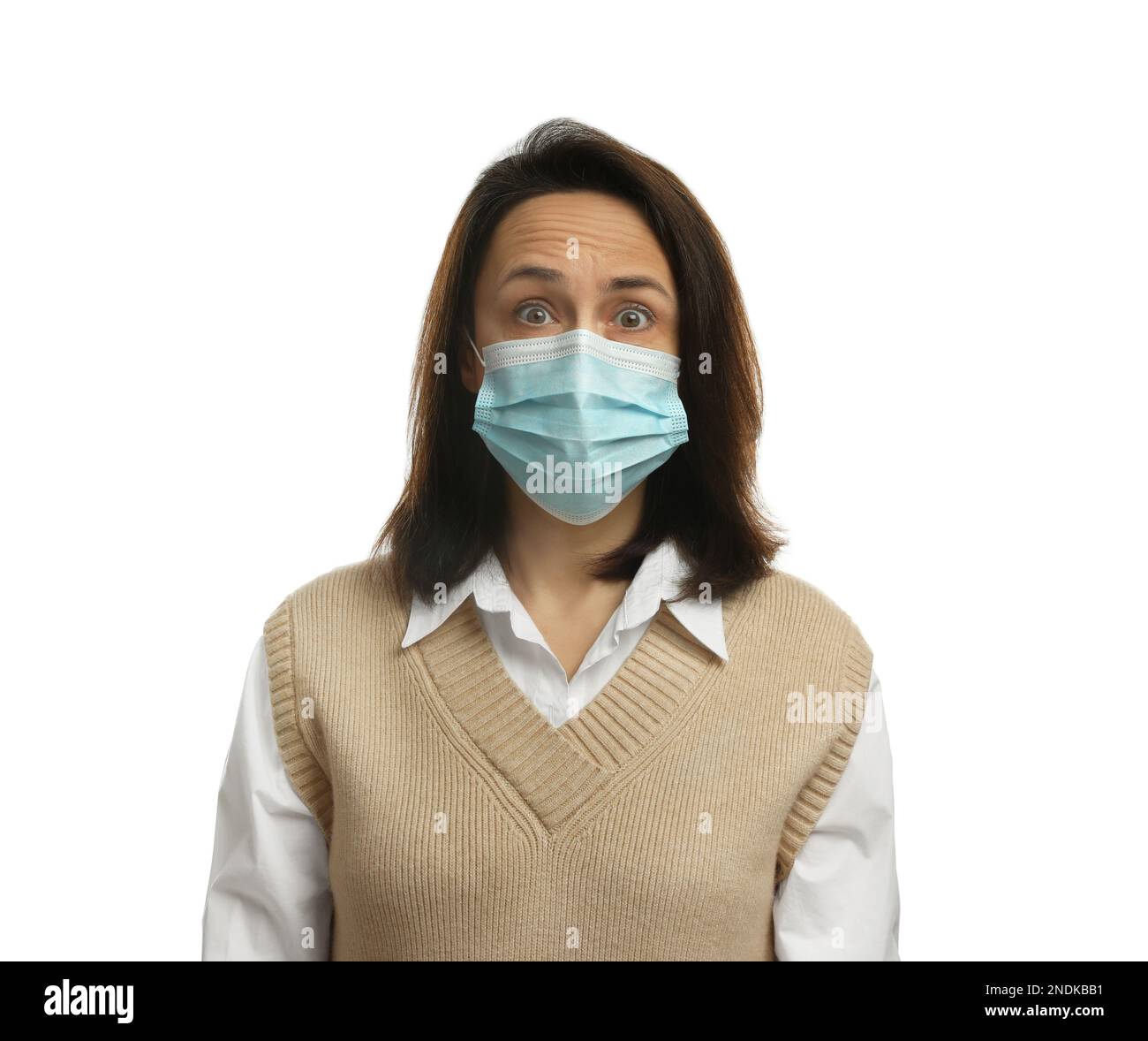 Mature woman in protective mask feeling fear on white background Stock ...