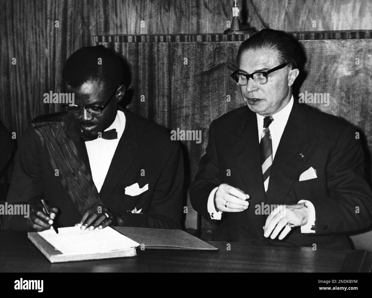 Patrice Lumumba, the Prime Minister of the Congo, signs the act of ...