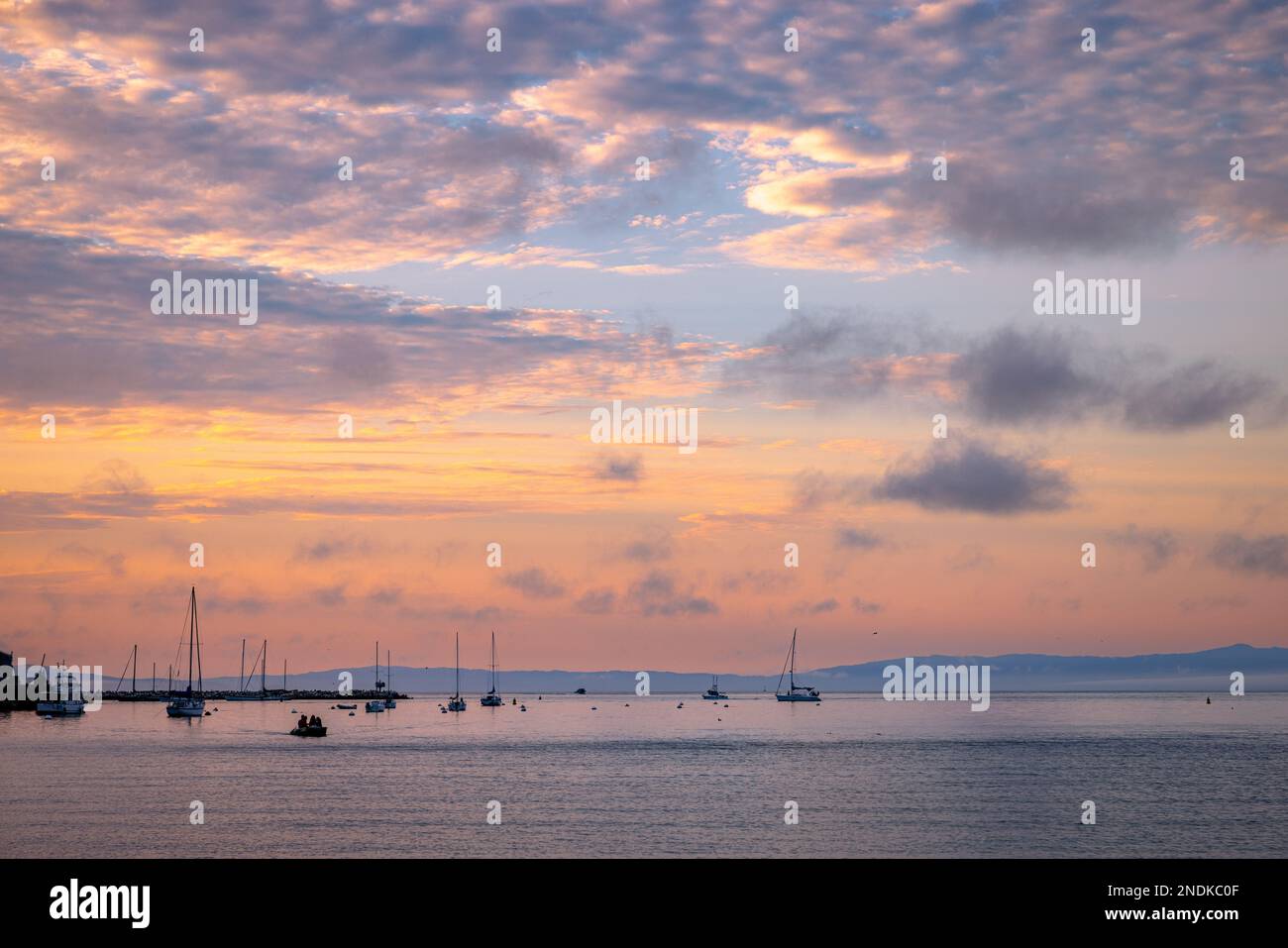 A beautiful sunset from Del Monte beach next to the Monterey Harbor ...