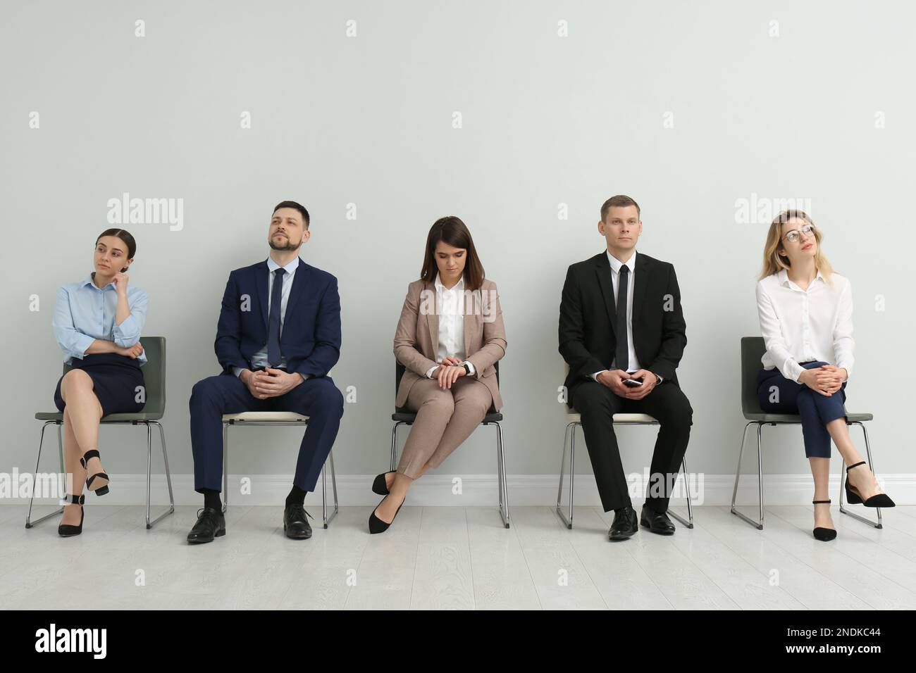 People waiting for job interview in office hall Stock Photo - Alamy