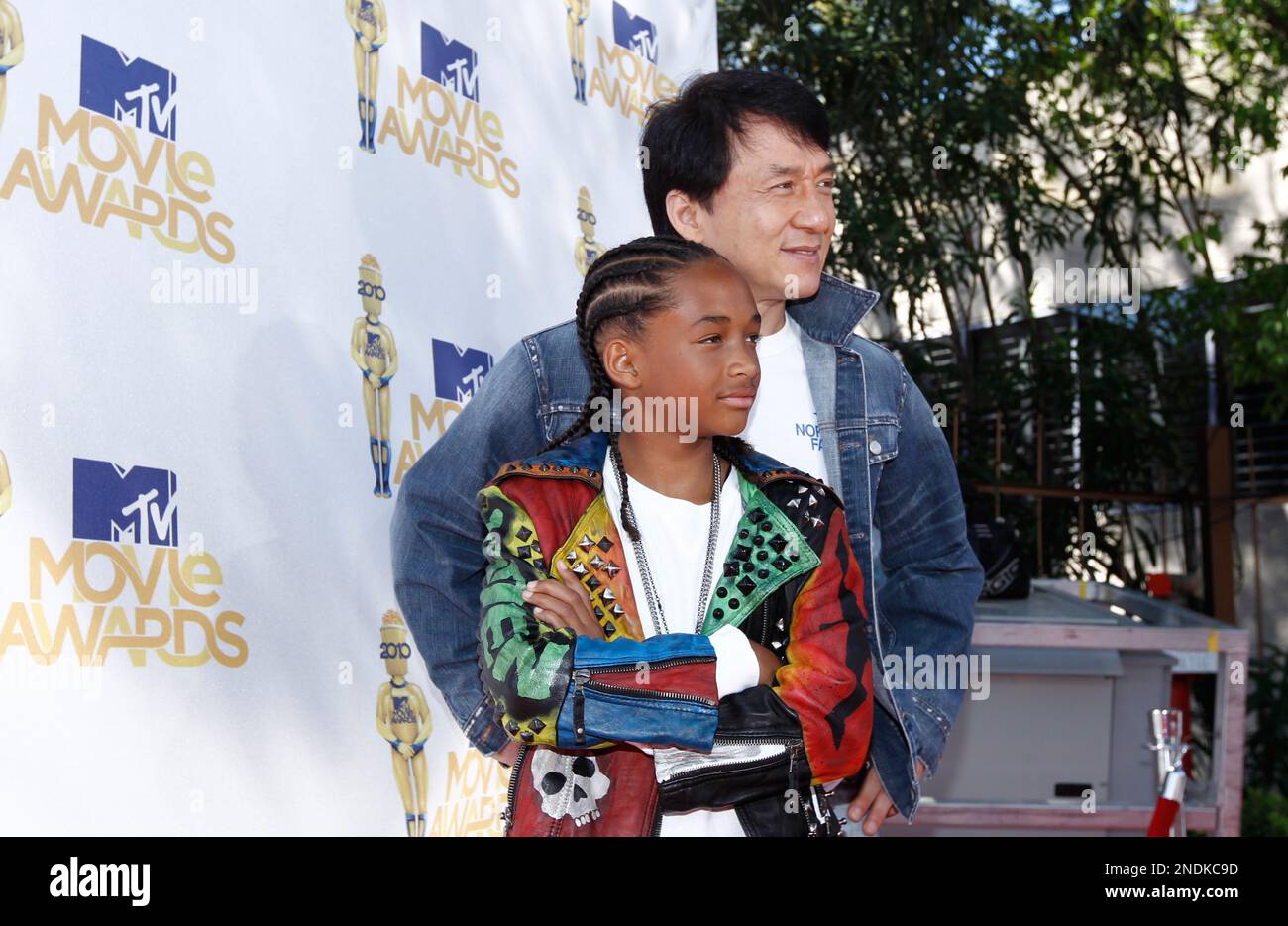 Jackie Chan, background, and Jaden Smith arrive at the MTV Movie Awards ...