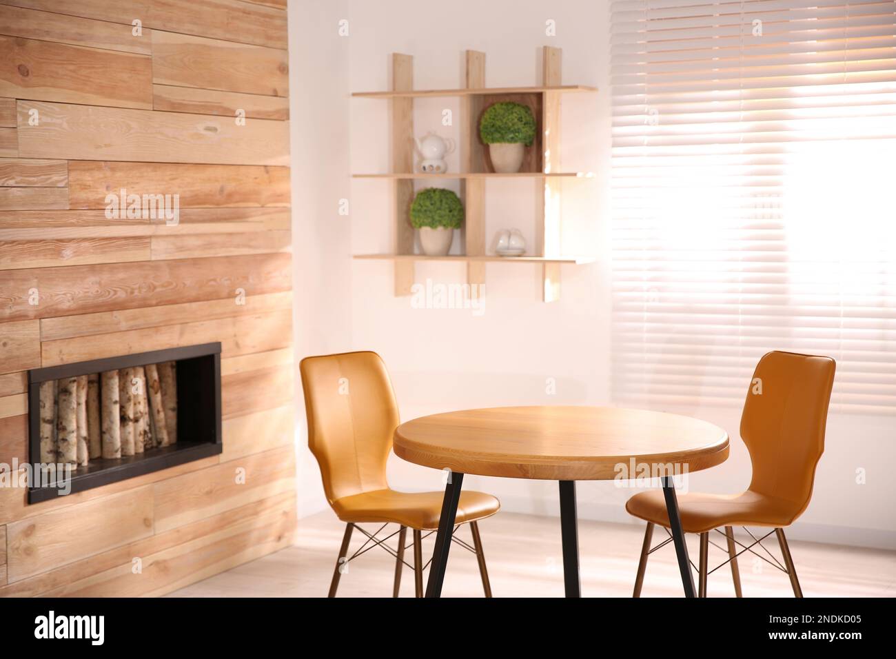 Modern dining room interior with stylish wooden table Stock Photo - Alamy