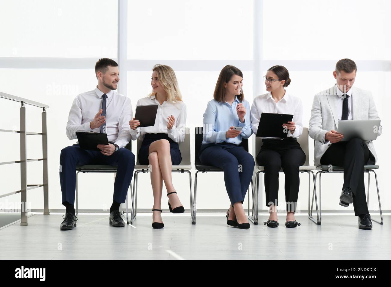 People waiting for job interview in office hall Stock Photo - Alamy