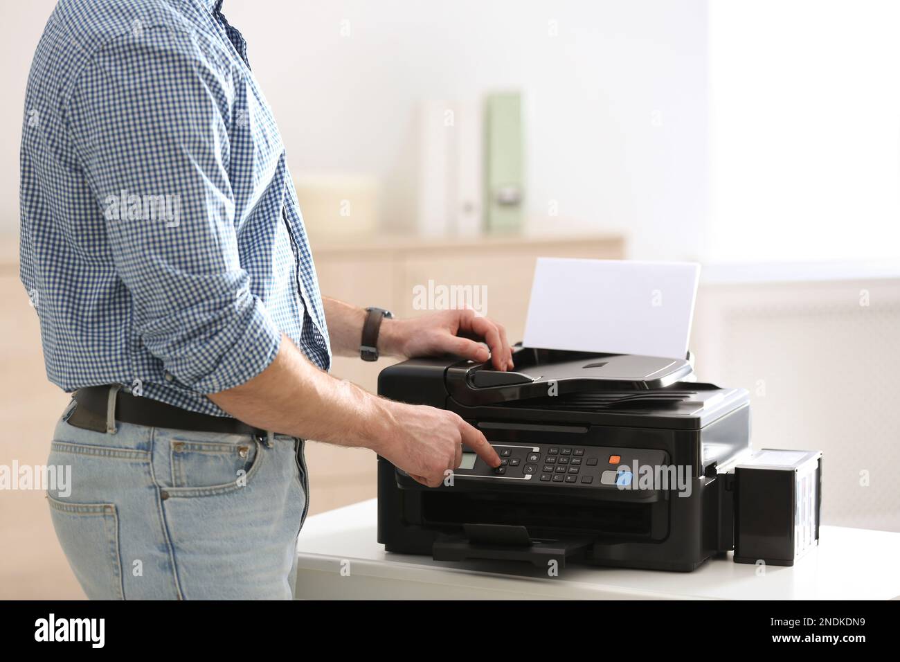 Employee using modern printer in office, closeup Stock Photo - Alamy