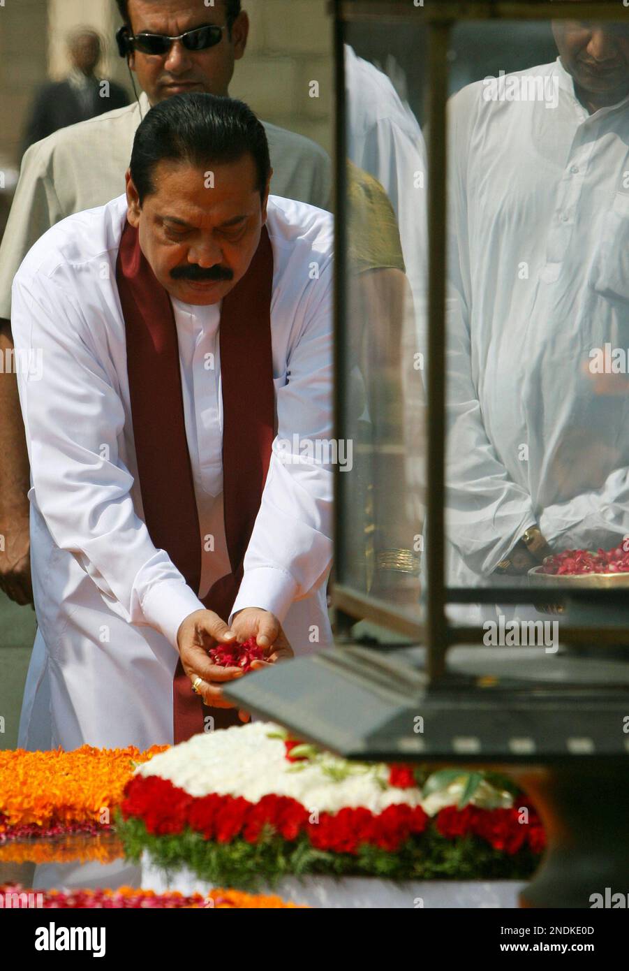 Sri Lankan President Mahinda Rajapaksa pays tribute at the memorial of ...