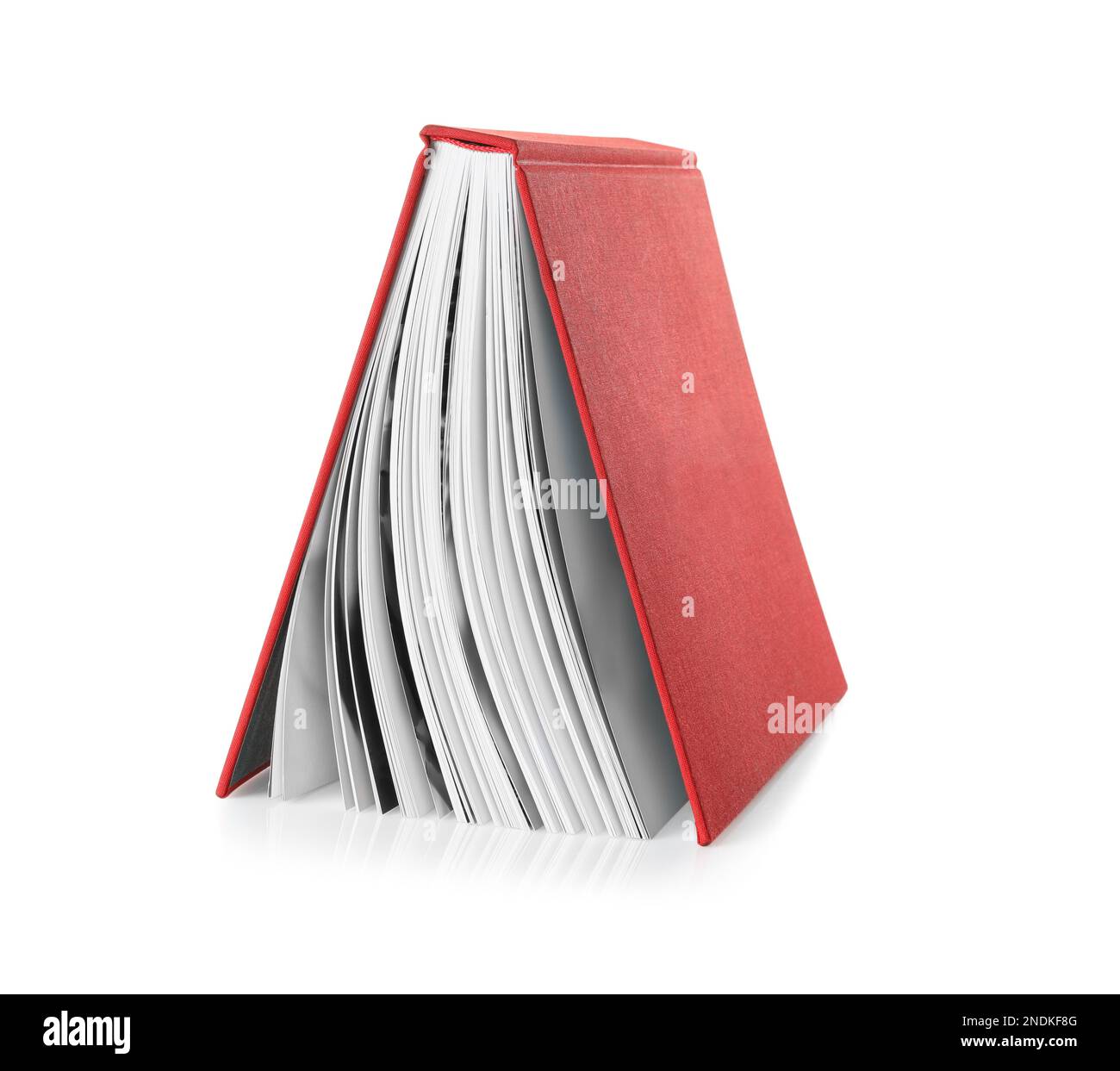 Book with red cover on white background Stock Photo - Alamy