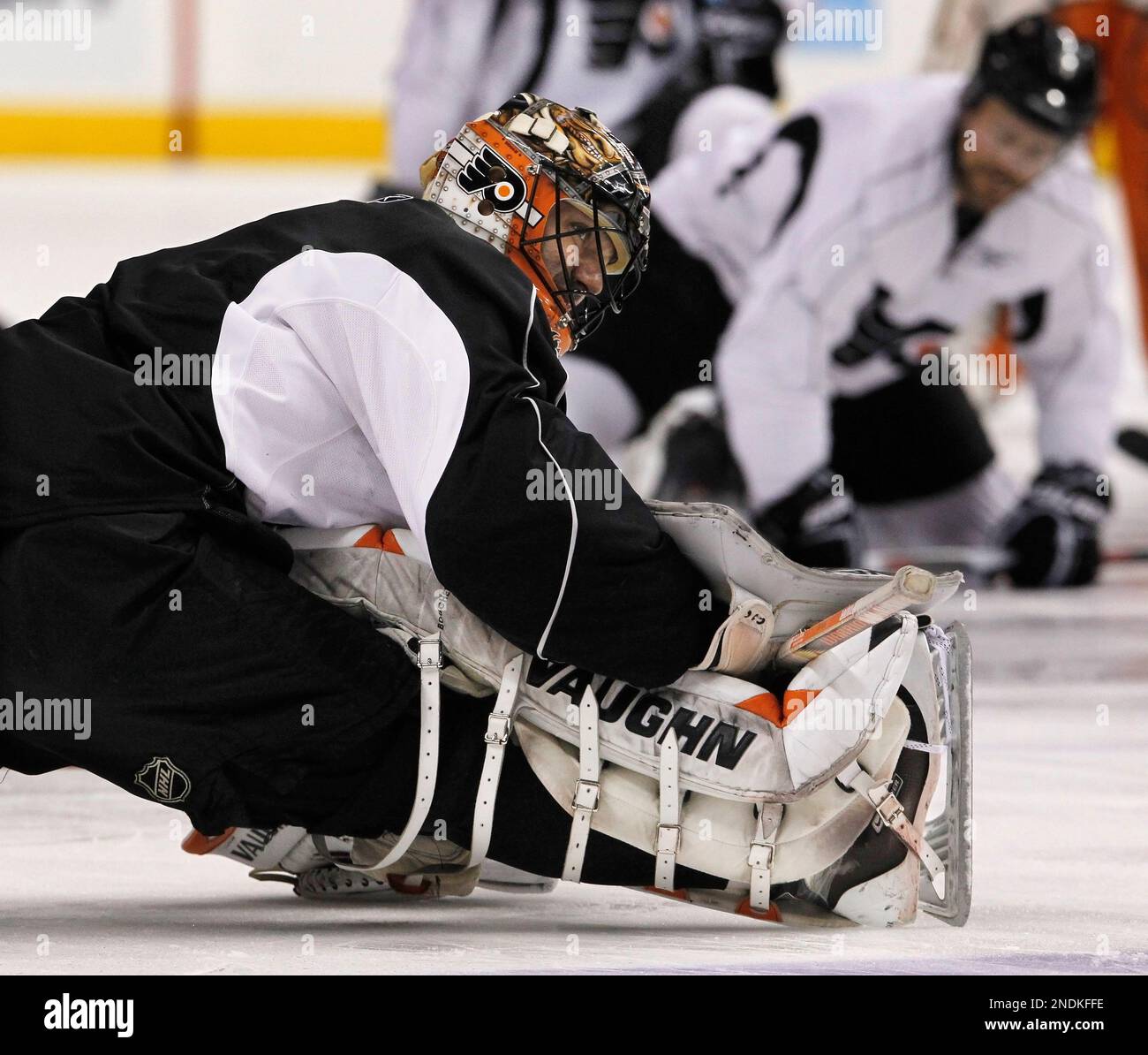 Philadelphia Flyers goalie Brian Boucher stretches during practice at ...