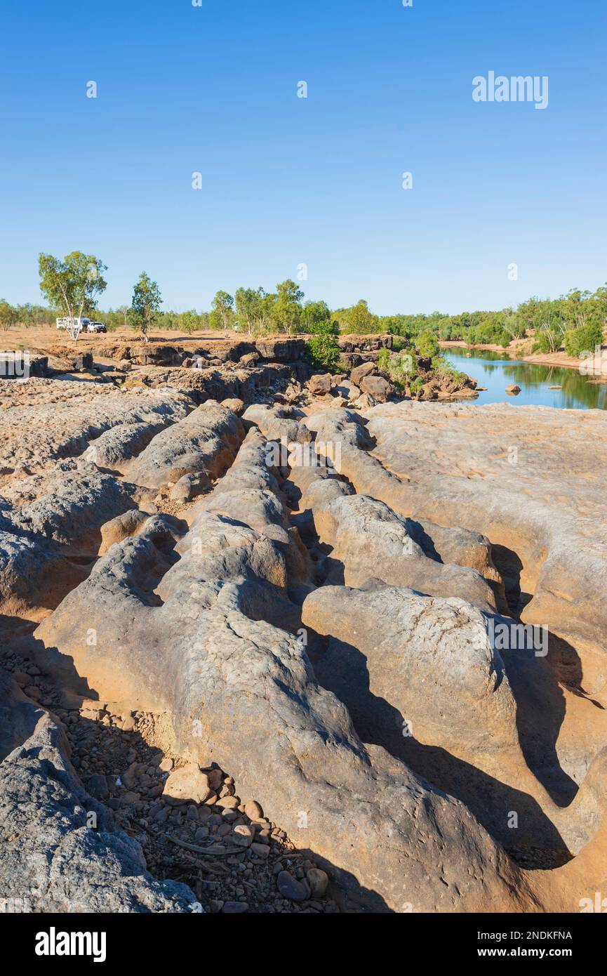 Camping by the eroded riverbed of the Leichhardt River at Leichhardt ...