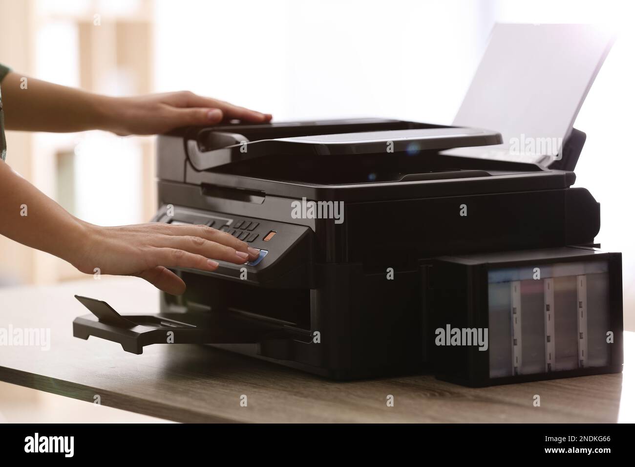 Employee using modern printer in office, closeup Stock Photo - Alamy
