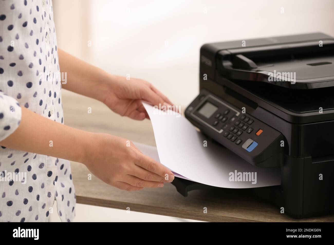 Employee using modern printer in office, closeup Stock Photo - Alamy