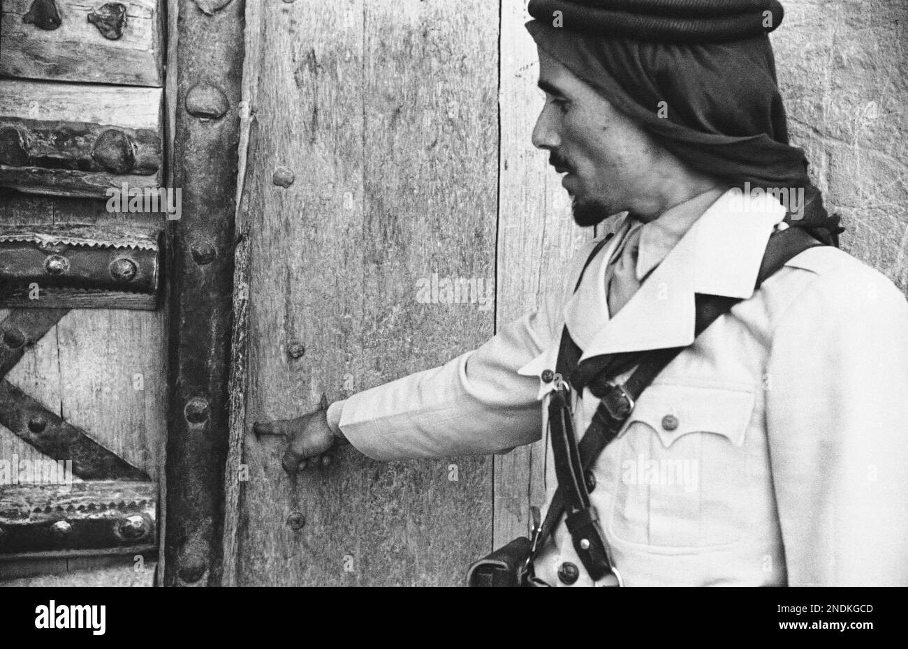 Captain Said of Saudi Arabian army points to doorway in which there is ...