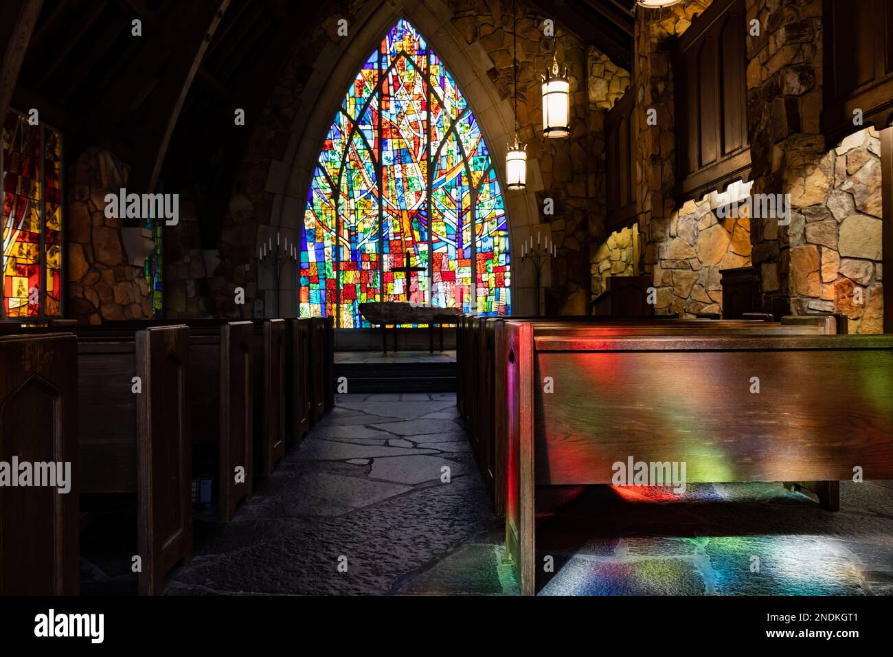 The interior of a church with colourful glass windows Stock Photo - Alamy
