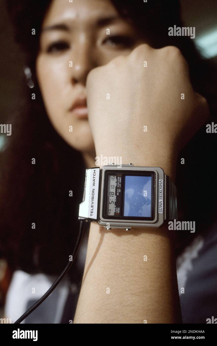 A model displays the world's first wristwatch with a black and white TV ...