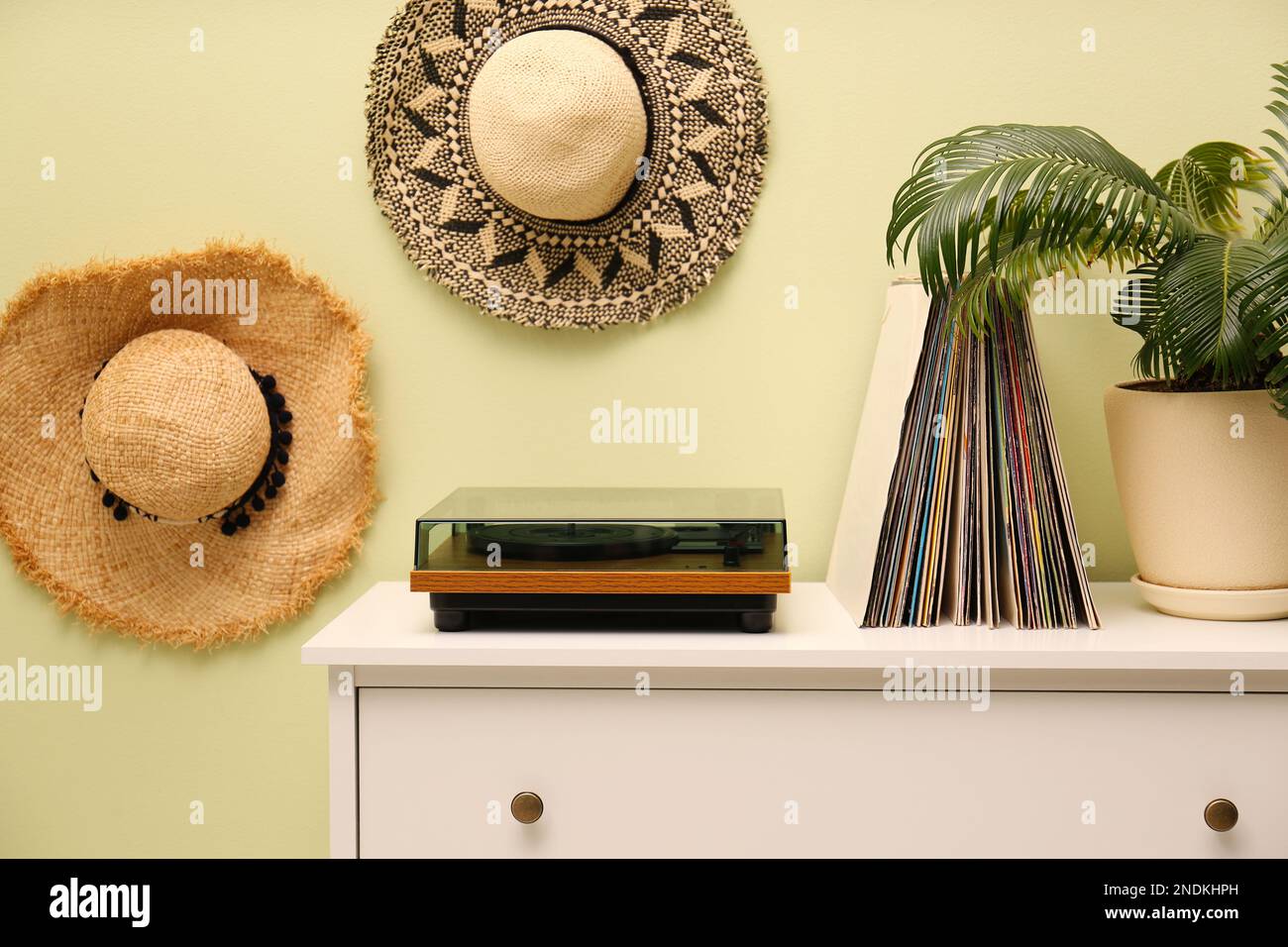 Stylish room interior with turntable and collection of vinyl records ...