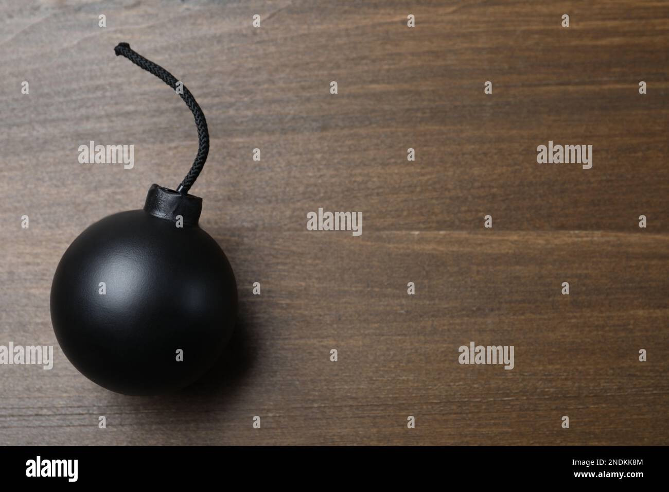 Old fashioned fuse bomb on wooden table, top view. Space for text Stock ...
