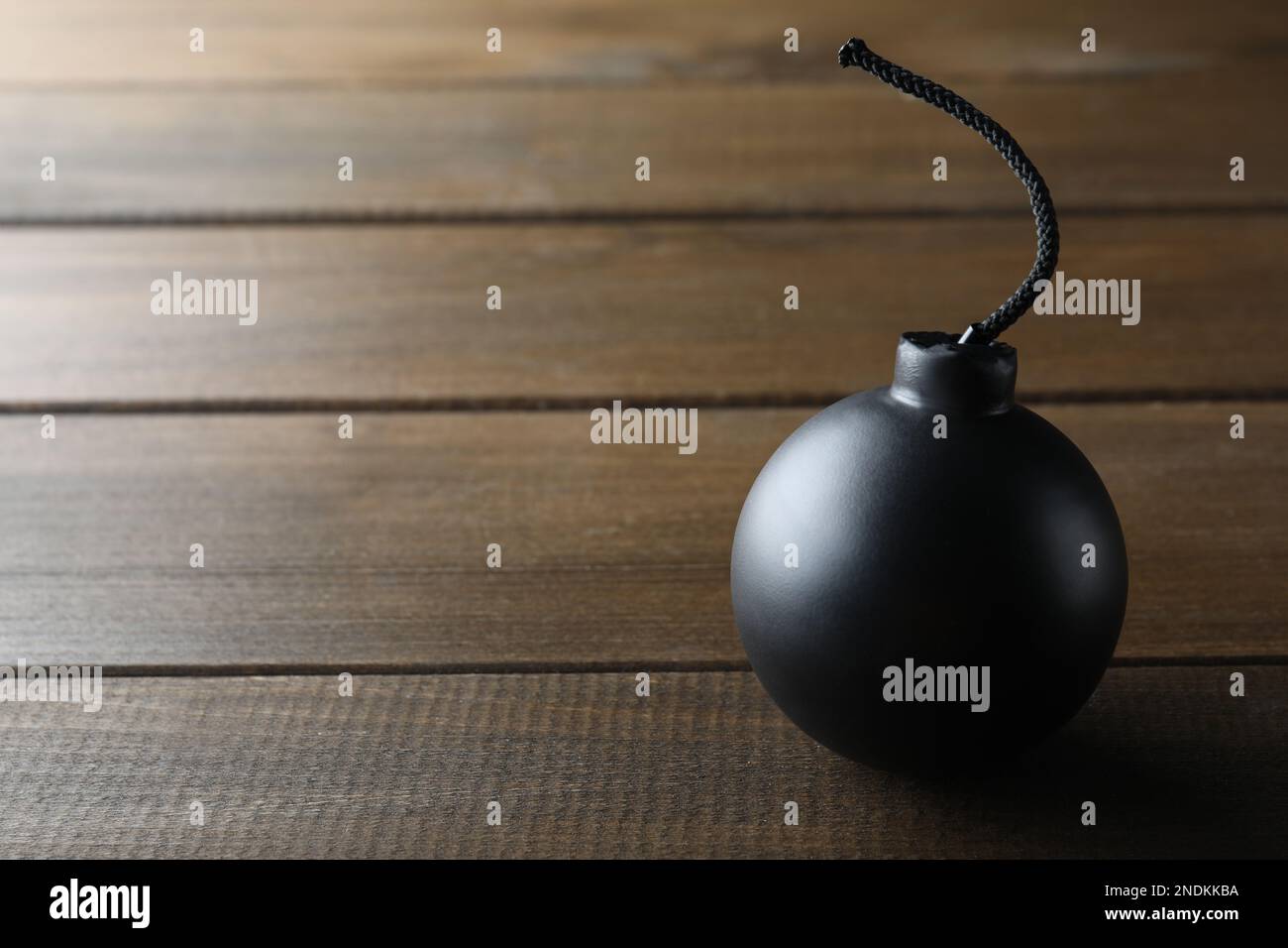 Old fashioned fuse bomb on wooden table. Space for text Stock Photo - Alamy