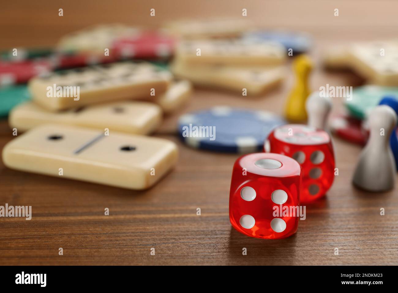 Elements of different board games on wooden table, closeup Stock Photo ...