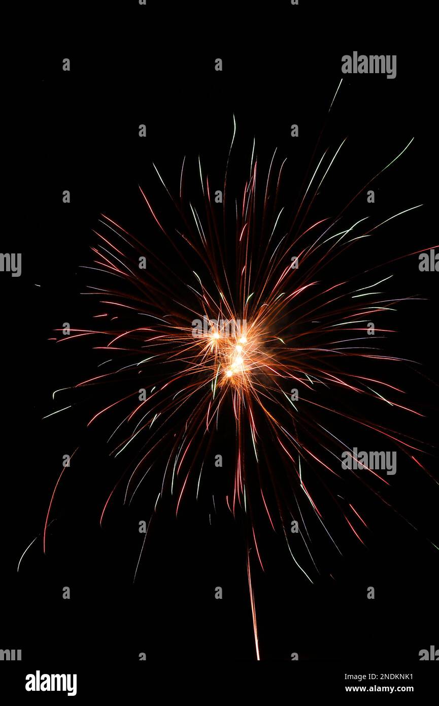 Beautiful bright firework lighting up night sky Stock Photo - Alamy