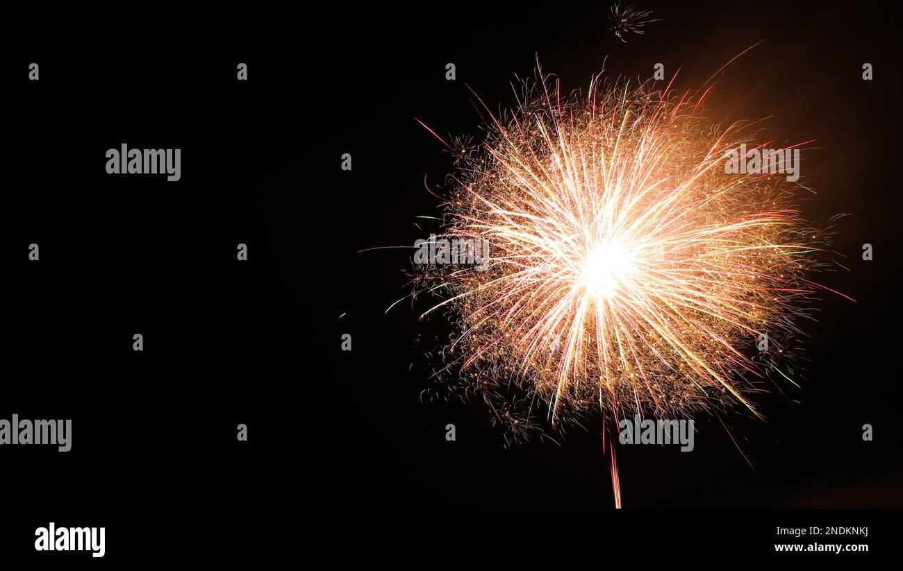 Beautiful bright firework lighting up night sky, space for text Stock ...