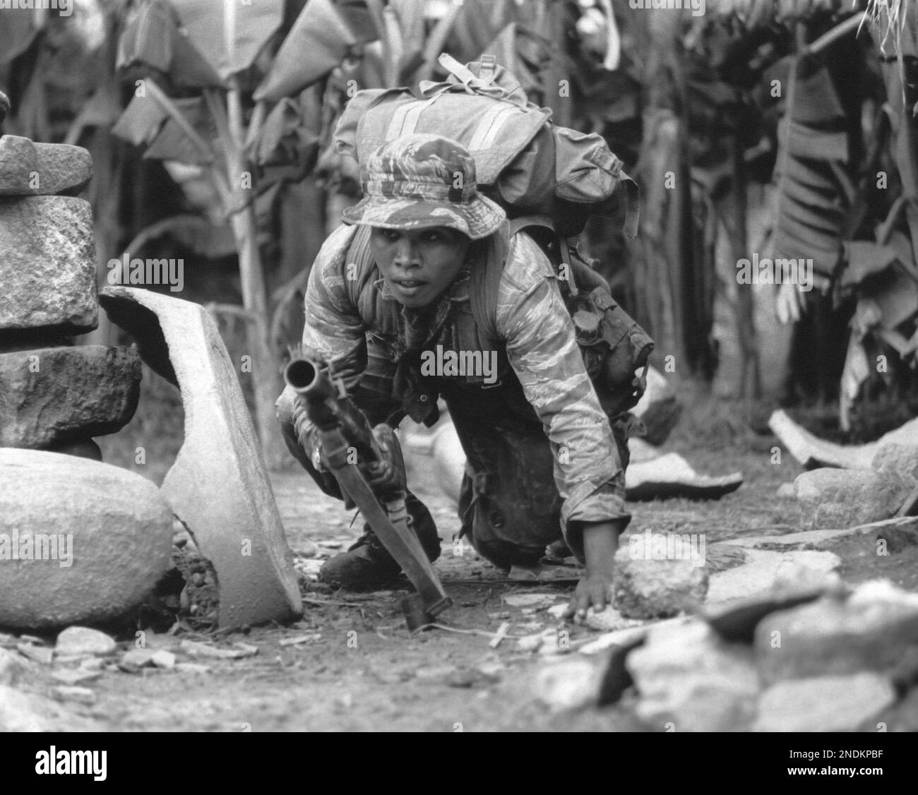 A South Vietnamese soldier attached to a mobile strike force uses a ...