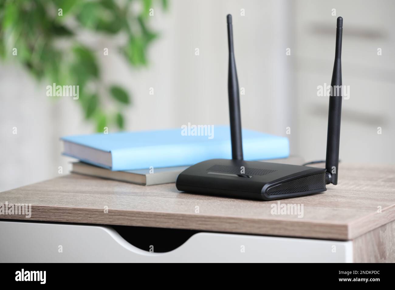 Modern Wi-Fi router indoors. Space for text Stock Photo - Alamy