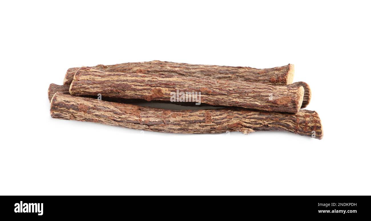 Dried sticks of liquorice root on white background Stock Photo - Alamy