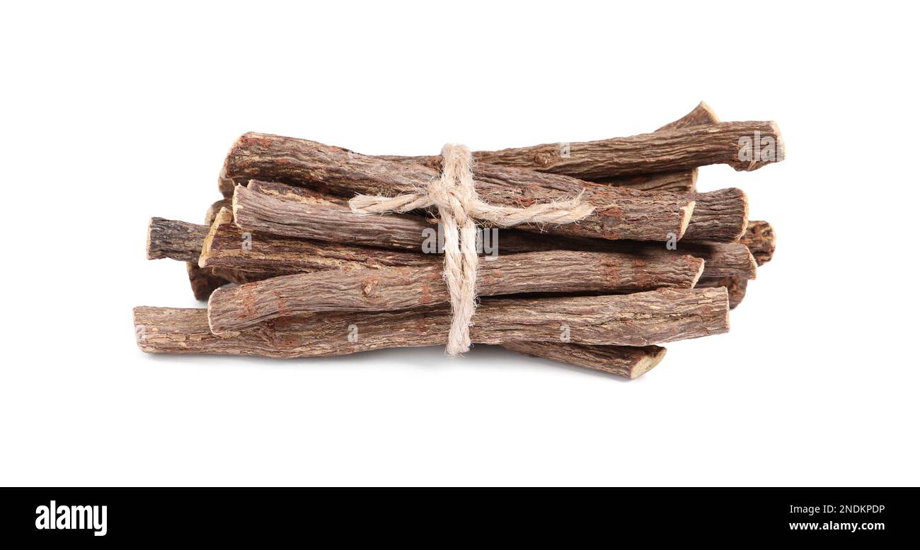Dried sticks of liquorice root on white background Stock Photo - Alamy