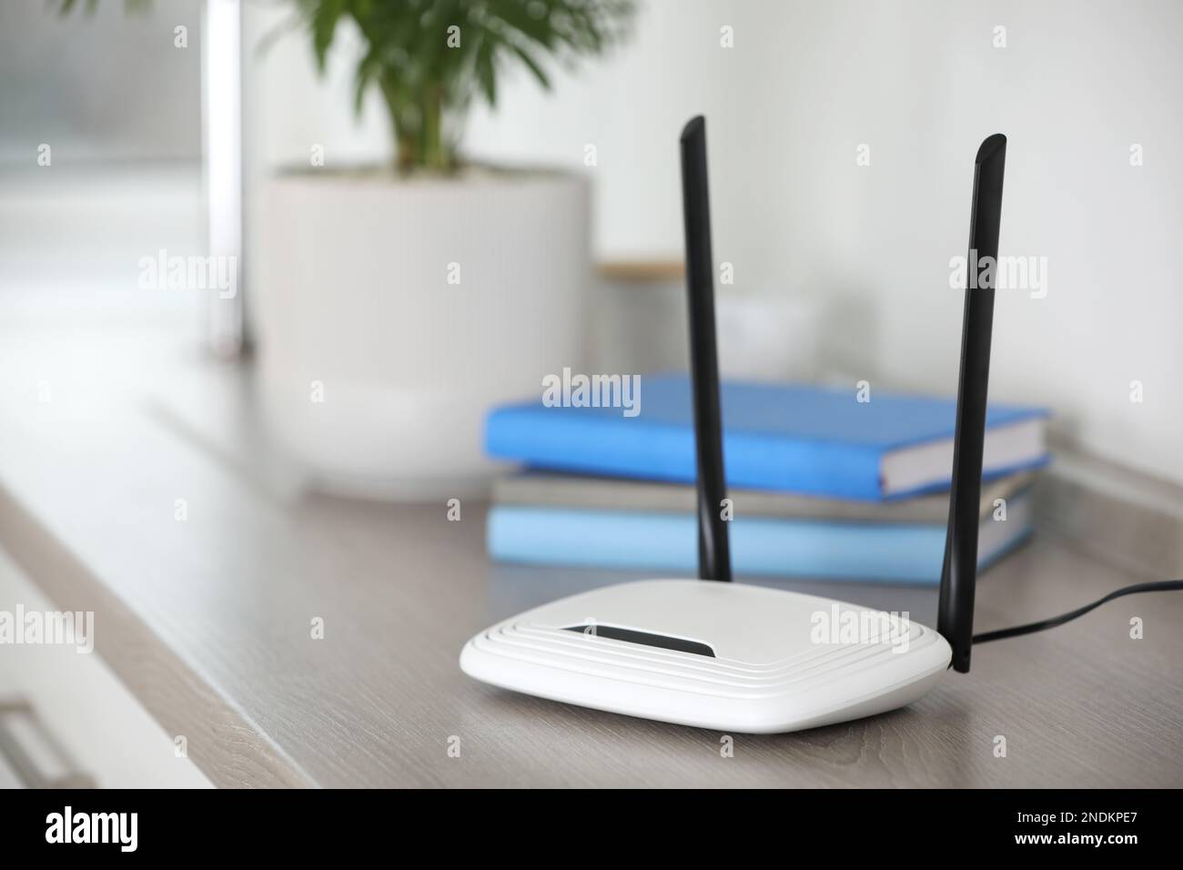 Modern Wi-Fi router indoors. Space for text Stock Photo - Alamy