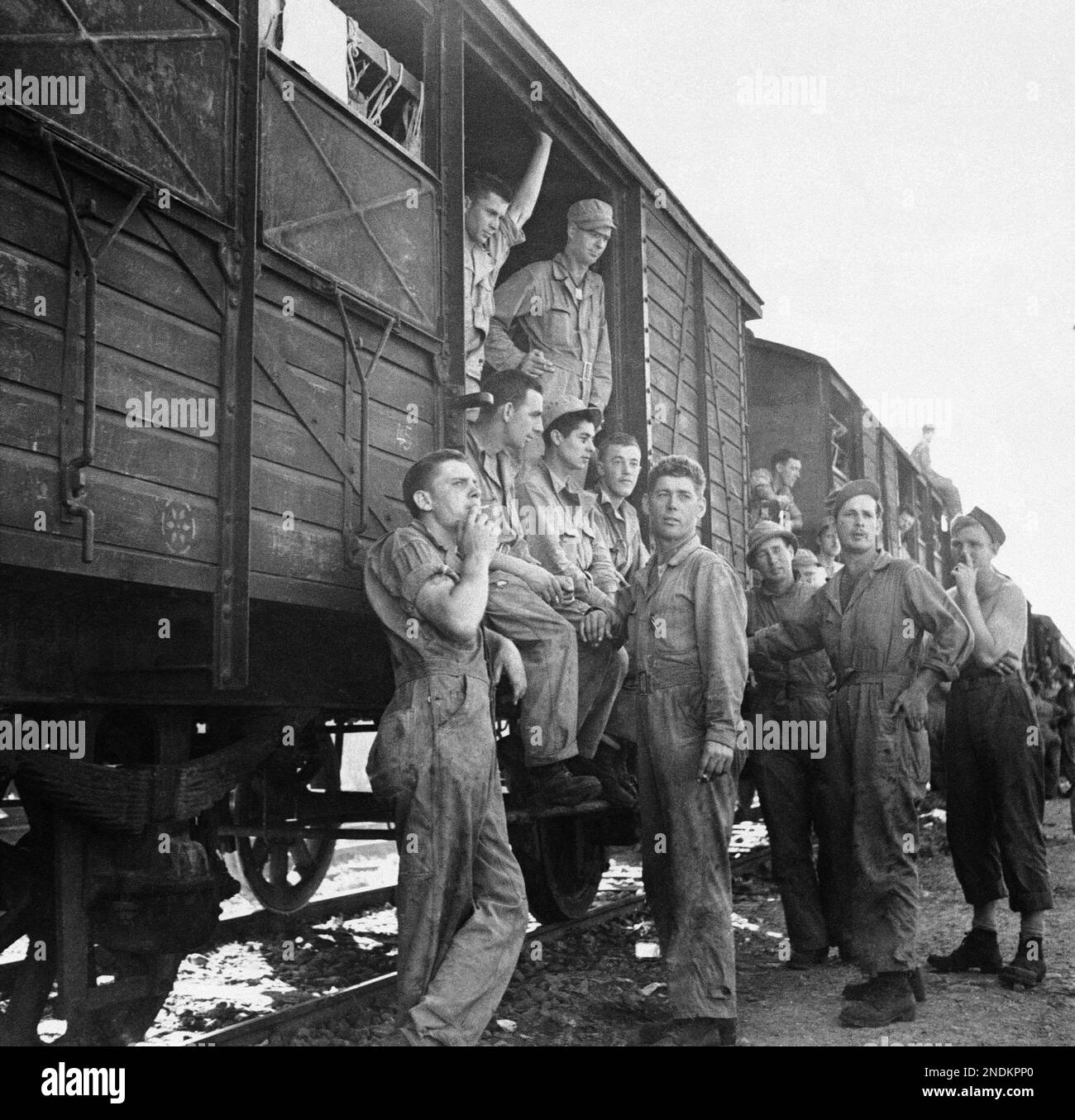 These American troops smoke and loll as a French railroad train stops ...