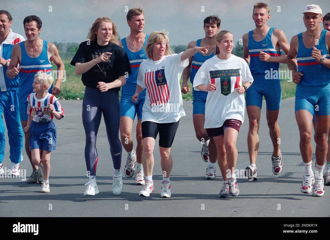 Members of Russia’s Men’s Olympic rowing team accompany Tipper Gore ...