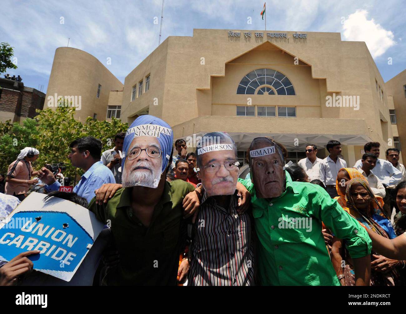 From left, activists wearing face masks of Union Carbide Company ...
