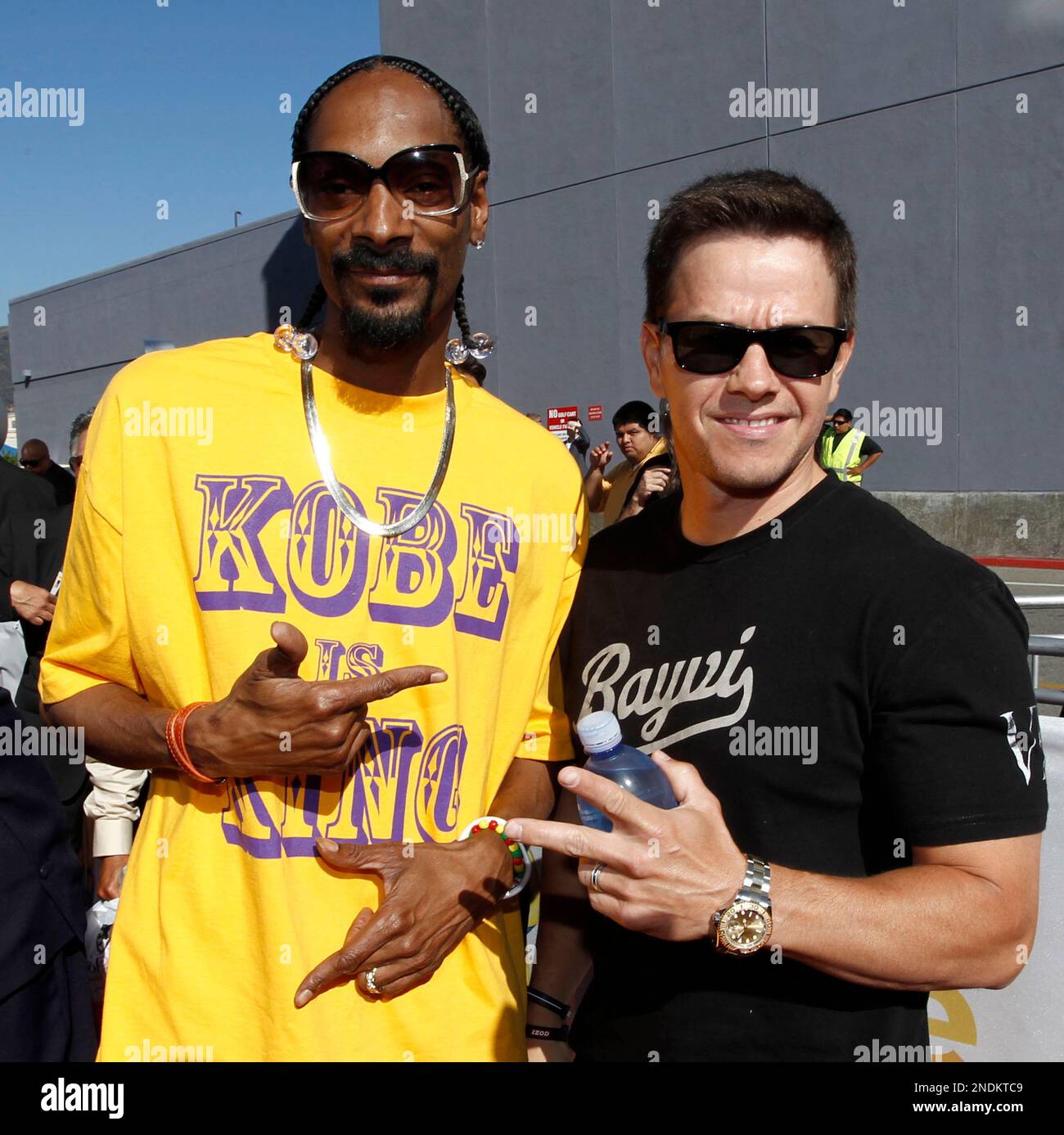 Calvin Broadus, better known as Snoop Dogg, left and Mark Wahlberg at ...