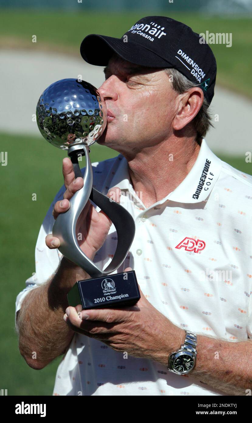 Nick Price kisses the trophy after winning the Champions Tour Principal ...