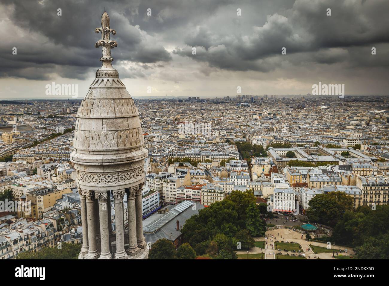 Paris skyline at dramatic storm clouds with La Defense above Montmartre ...