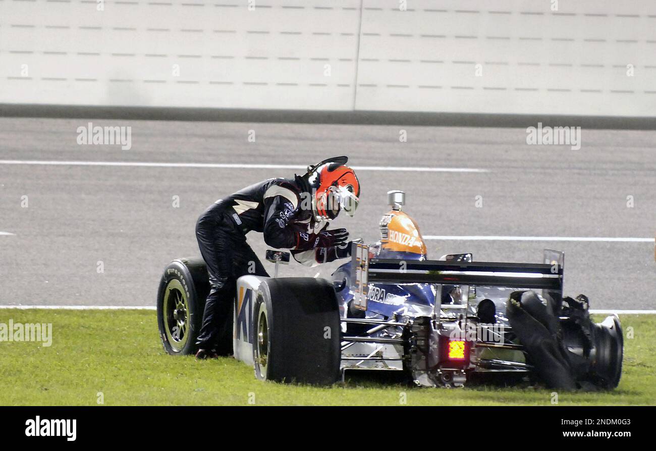 Indy Racing League driver Helio Castroneves, left, confronts Mario ...