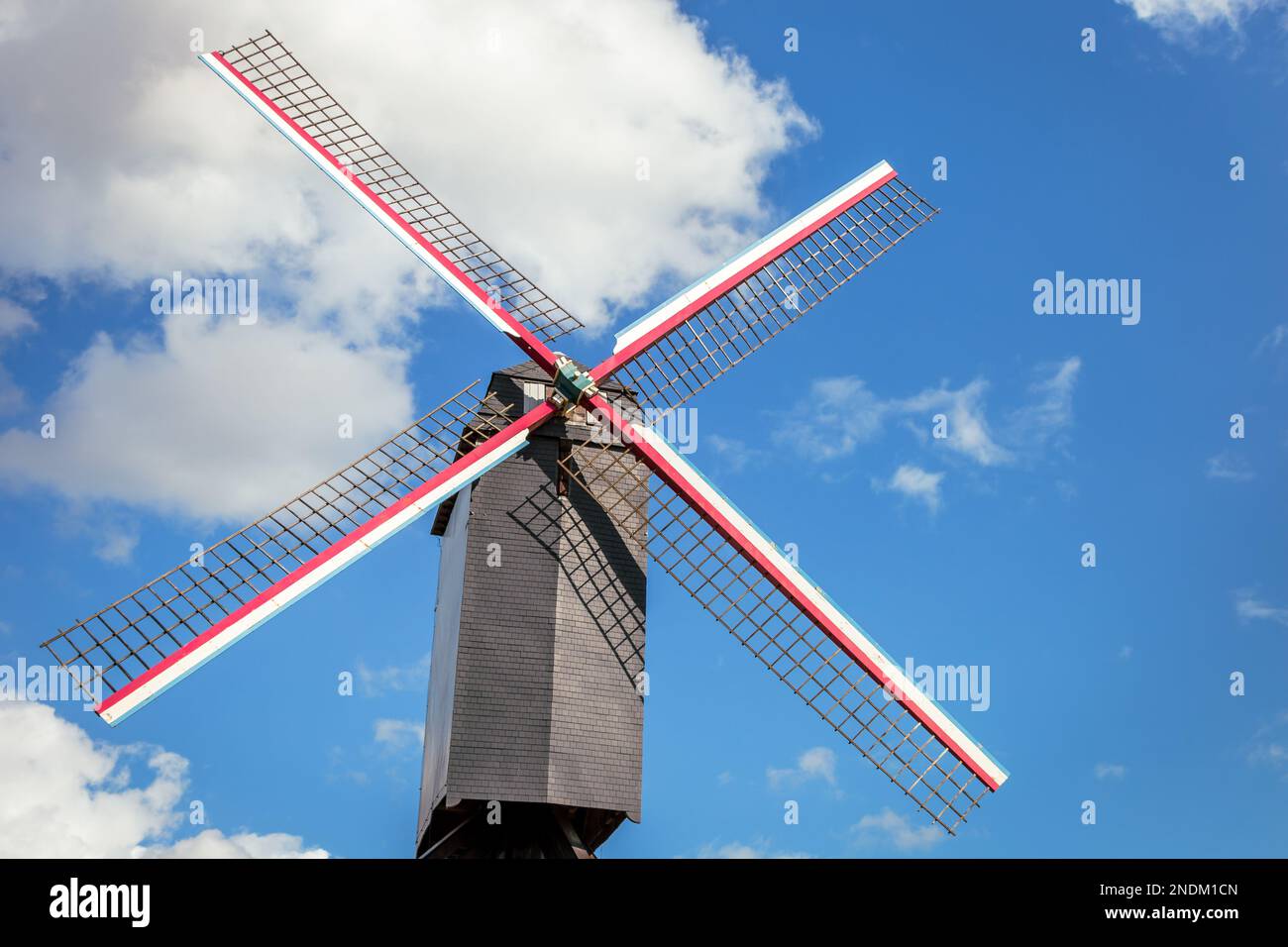 Rustic and iconic wooden windmill in idyllic Bruges public park ...