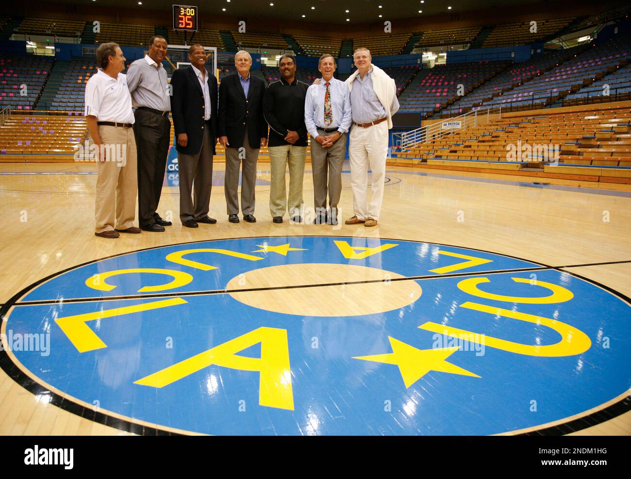 Several of coach John Wooden's former players, from left, Andy Hill ...