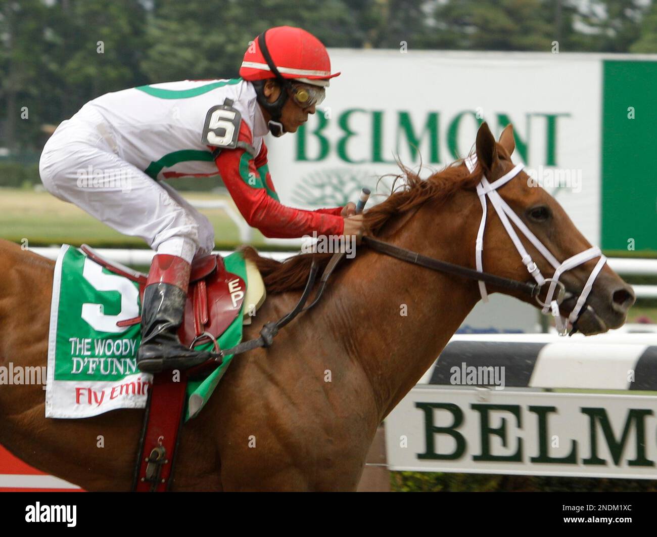 Jockey Edgar Prado rides D' Funnybone across the finish line to win the ...