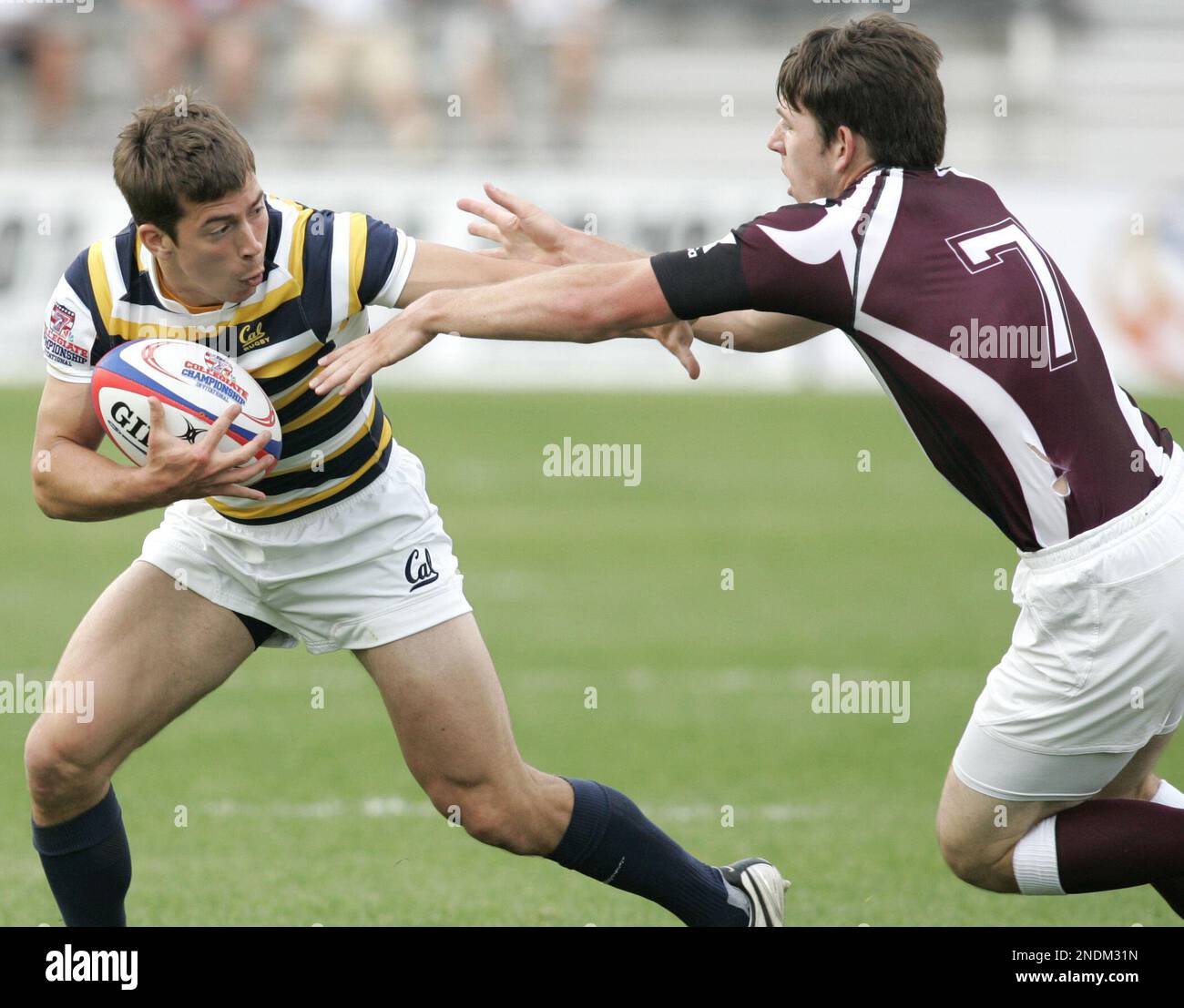 California's Dustin Muhn, left, tries to get past Harvard's Khaki Burke ...