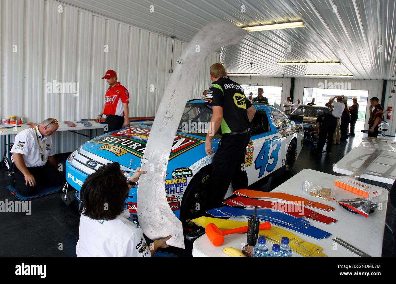 NASCAR officials Jerry Hines, left, and Pam Ford, holding template ...