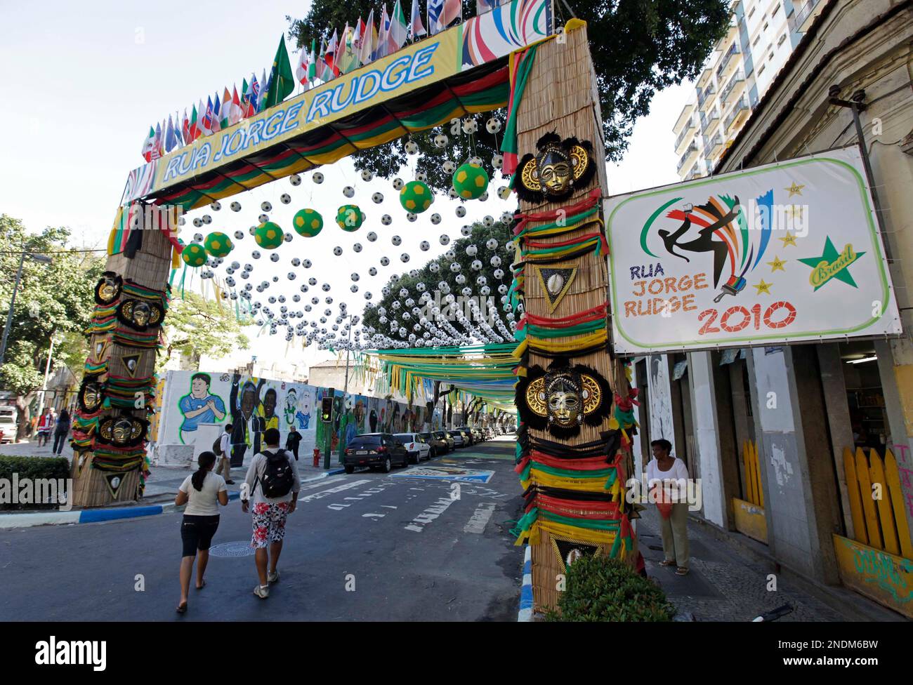 People walk along the Jorge Rudge street at the Vila Isabel ...