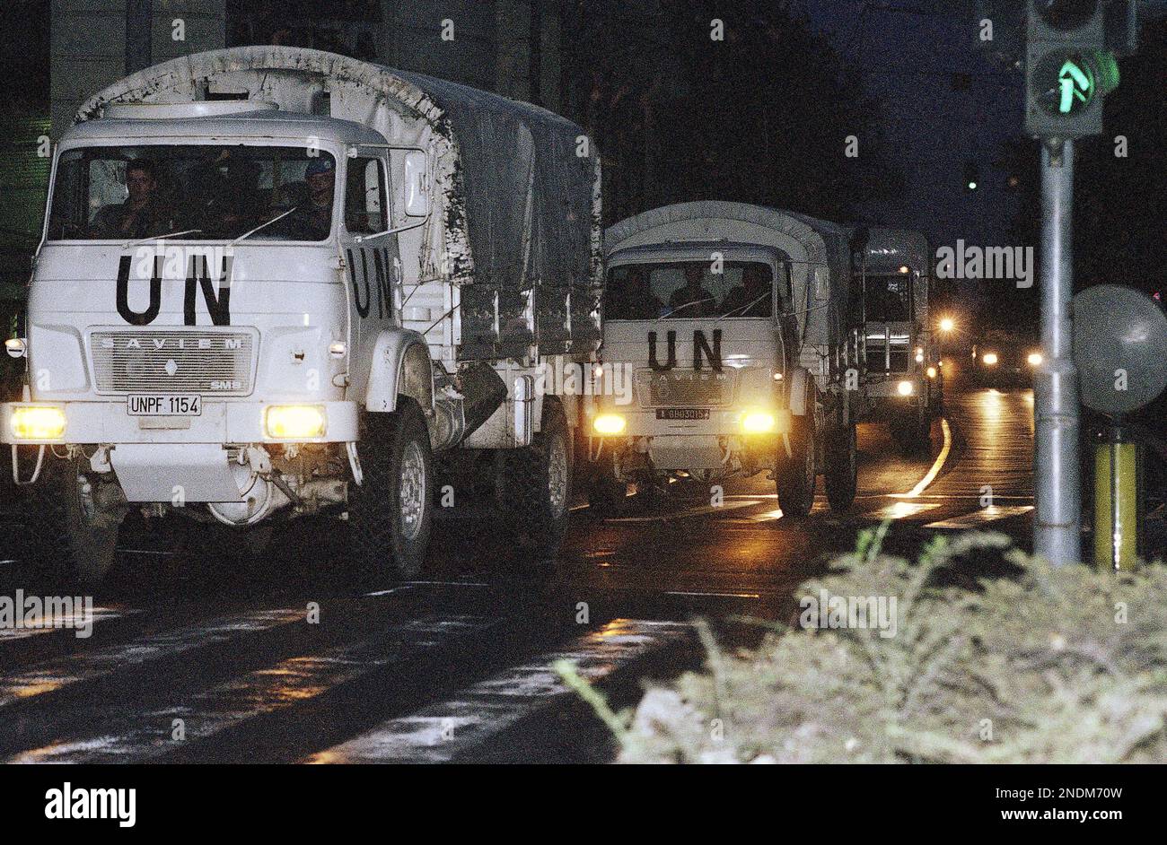 A convoy of U.N. trucks passes through the Yugoslav capital of Belgrade ...