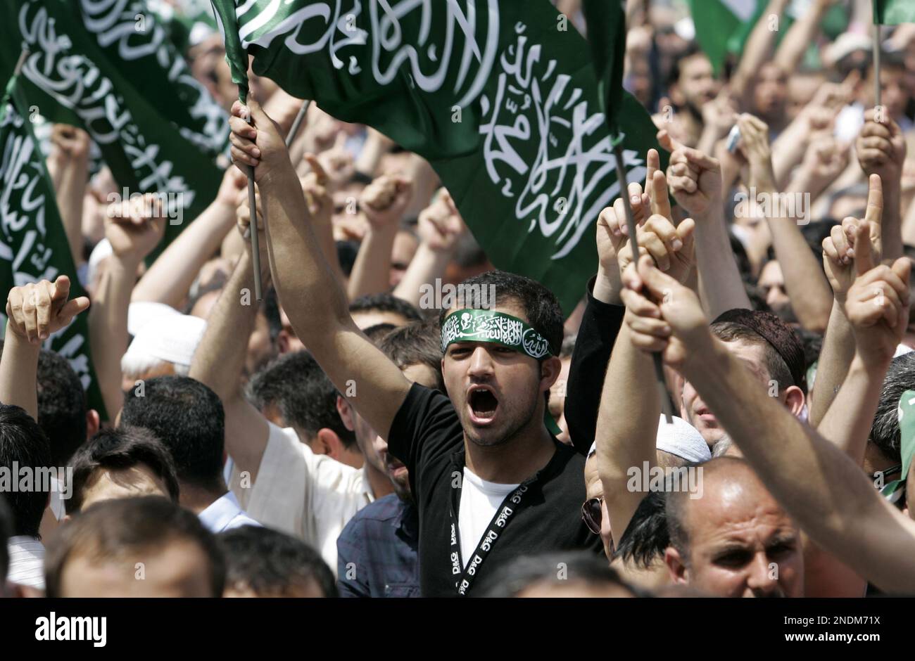 People shout religious slogans during the funeral of a victim of the ...